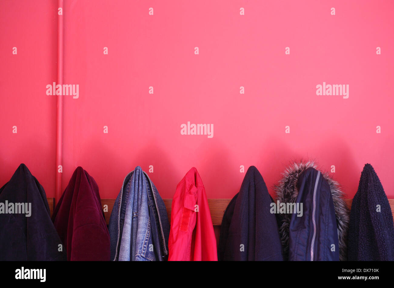 Coats hanging wall hi-res stock photography and images - Alamy