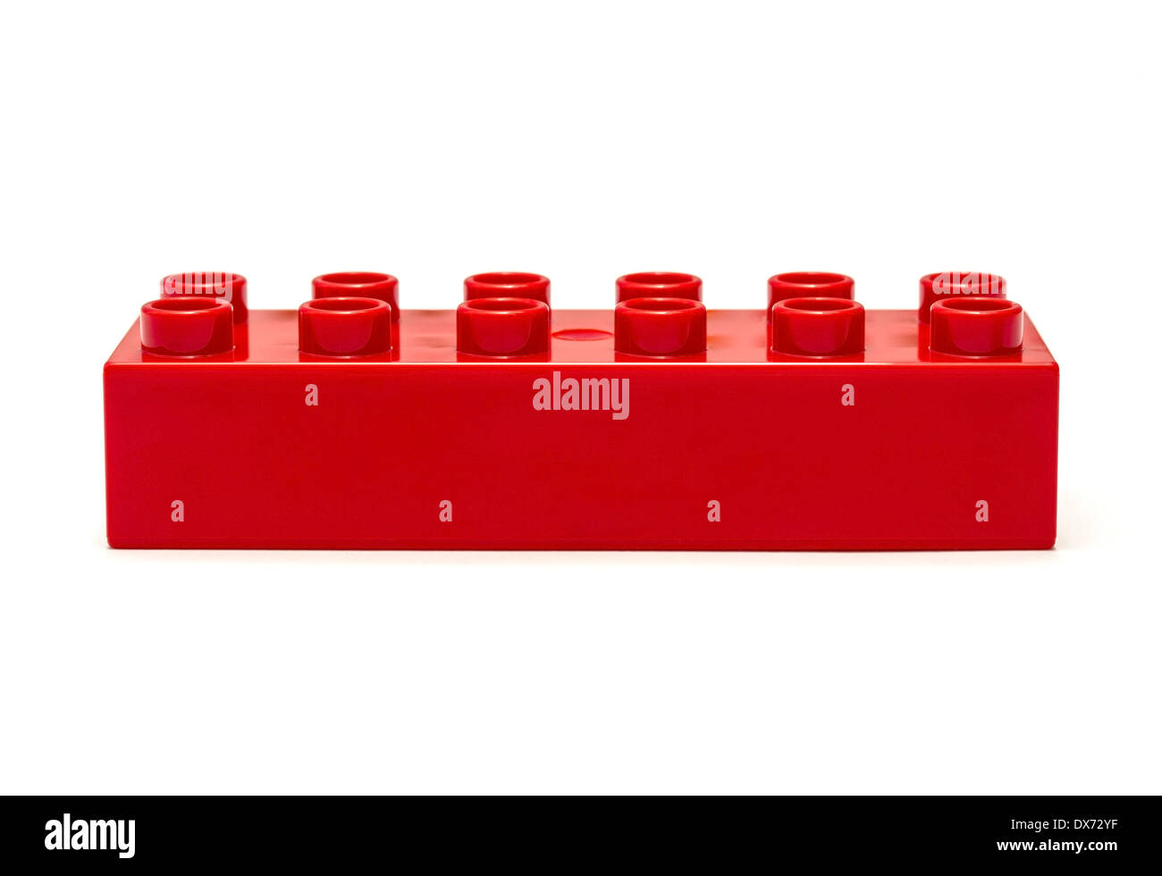 Red building block closeup on white background Stock Photo - Alamy