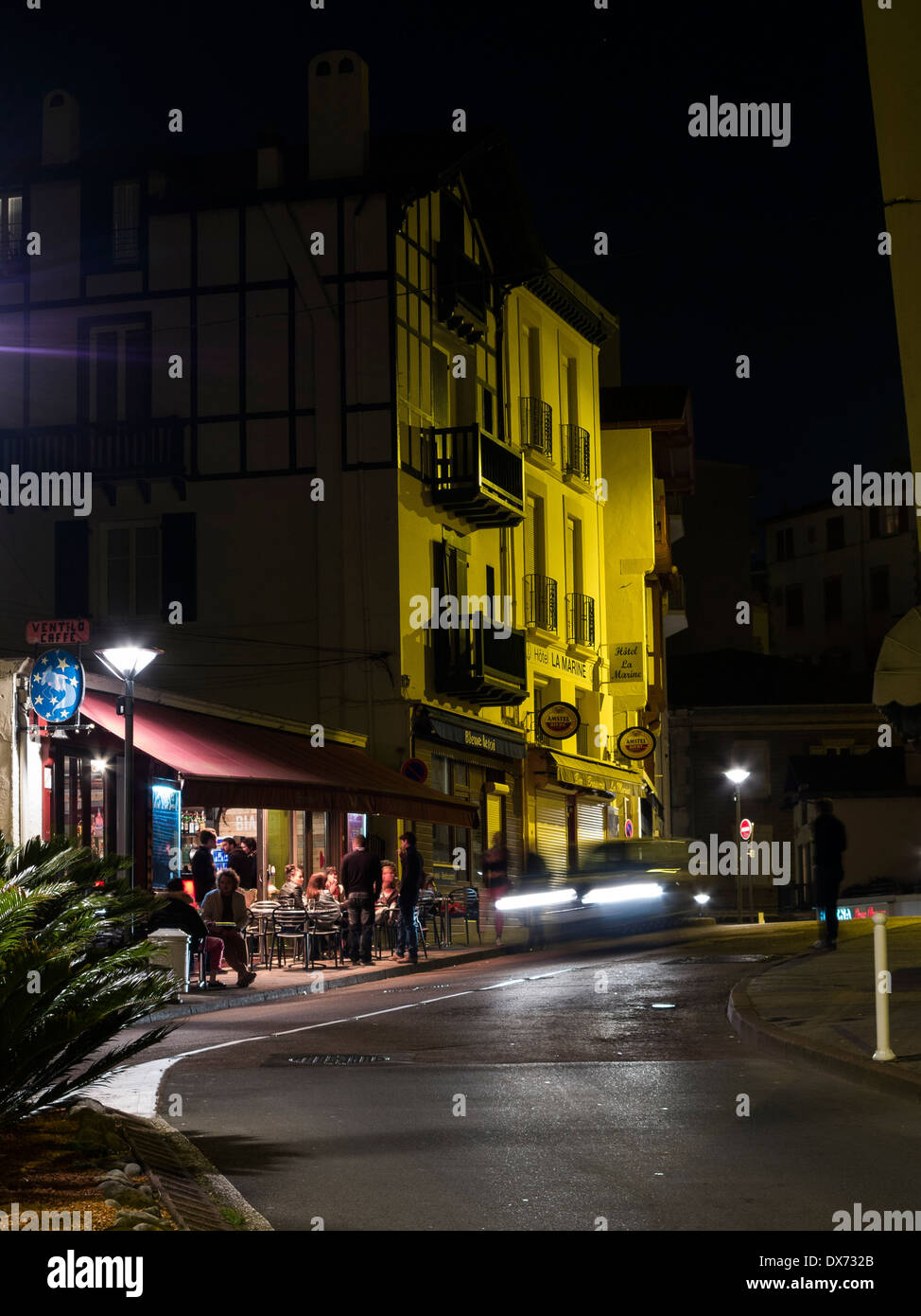 A bar on a street in Biarritz at night Stock Photo - Alamy