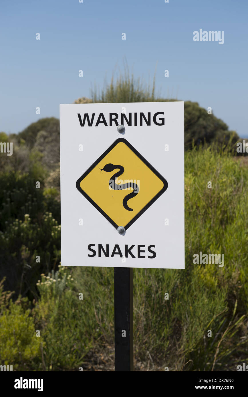 A sign warning of snakes Stock Photo - Alamy