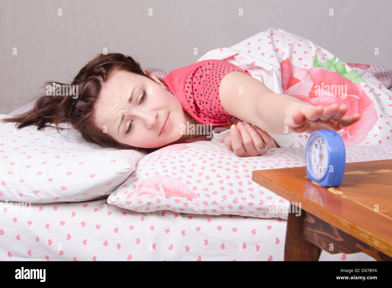 Girl sleeping in bed. It wakes service Stock Photo - Alamy