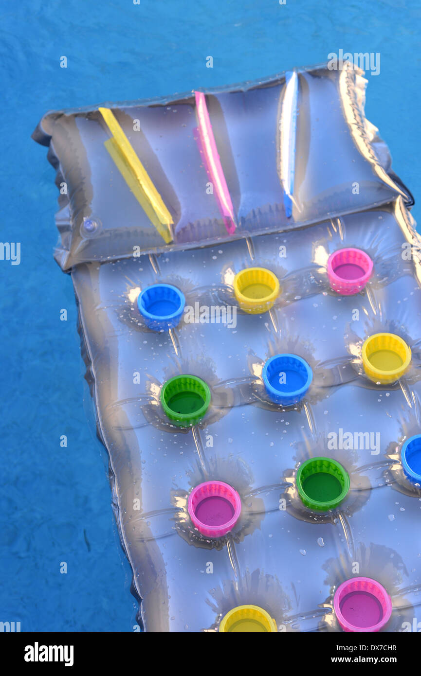 A pool bed floating in a pool Stock Photo - Alamy