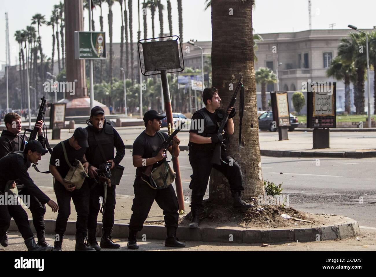 Cairo, Egypt. 19th Mar, 2014. Riot policemen clash with anti-military ...