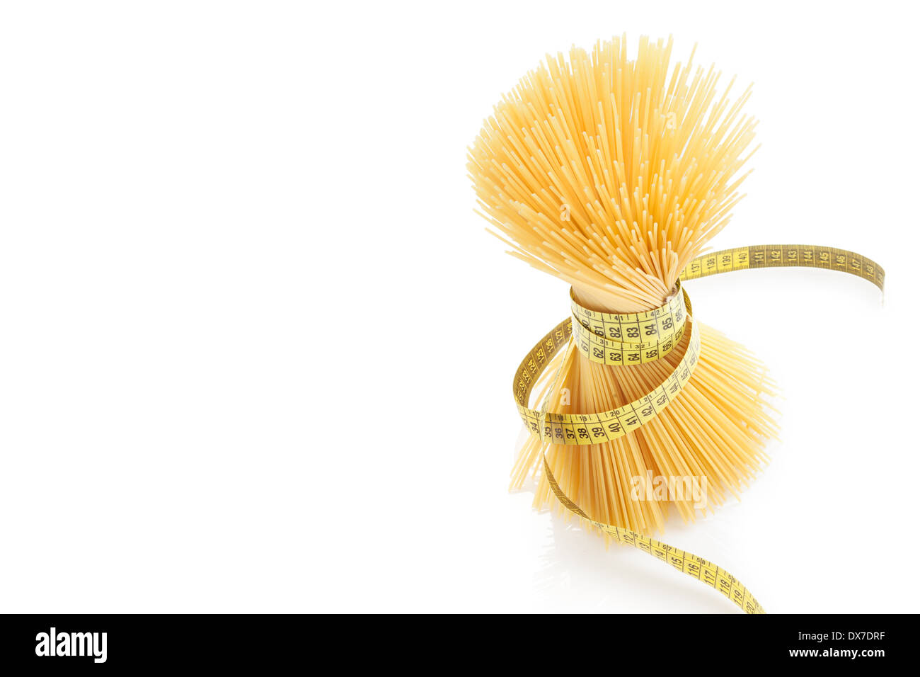 A meter coiled over the bunch of noodles forming female shape Stock ...