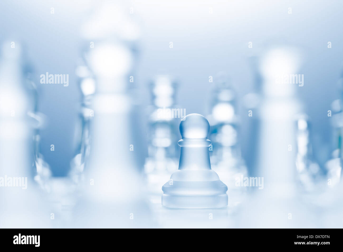 A conceptual photo of a transparent pawn made of glass on a chessboard ...