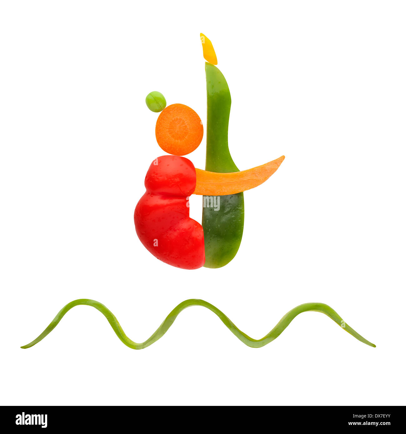 Fruits and vegs arranged in a diver shape jumping in a pike position ...