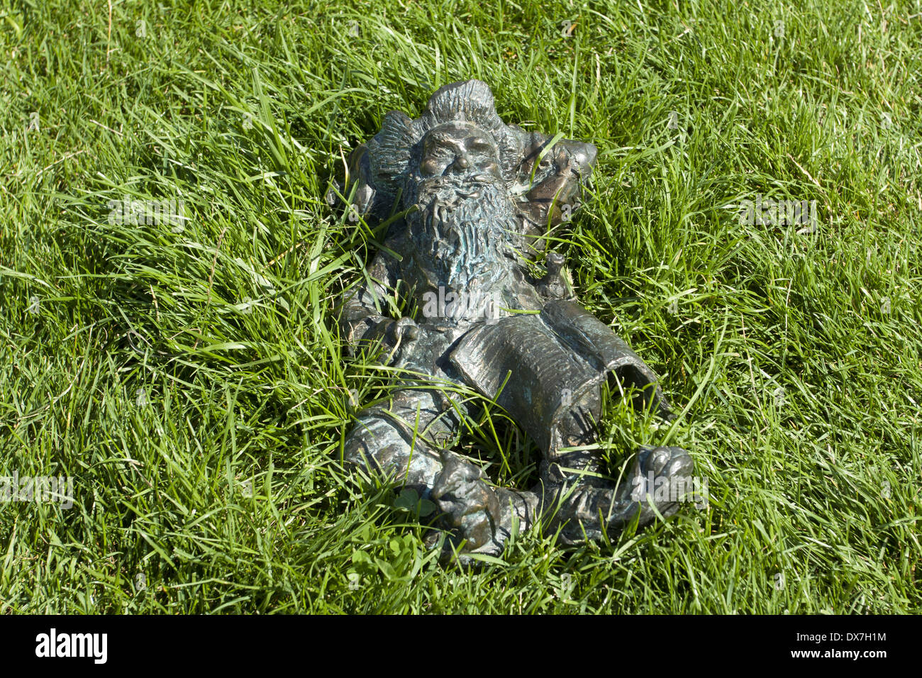 Statue of dwarf in grass in front of main railway station. In 2013 ...