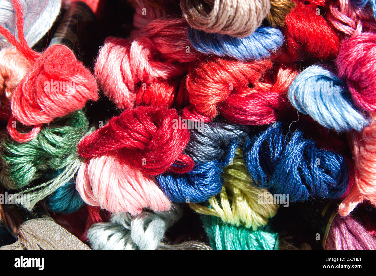 collection of multi colored skeins of embroidery cotton Stock Photo - Alamy