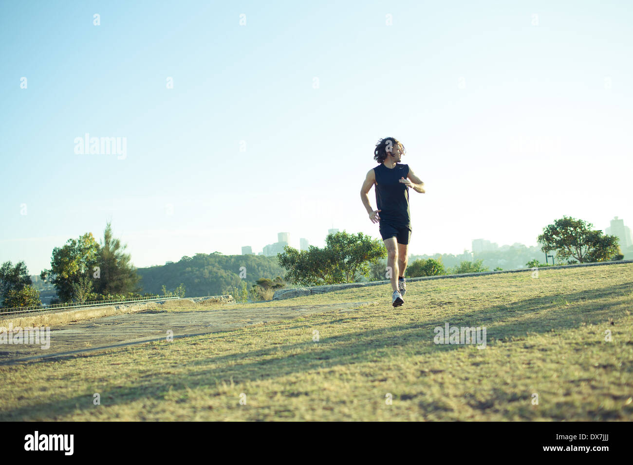 A young man on a sunny early morning run Stock Photo - Alamy