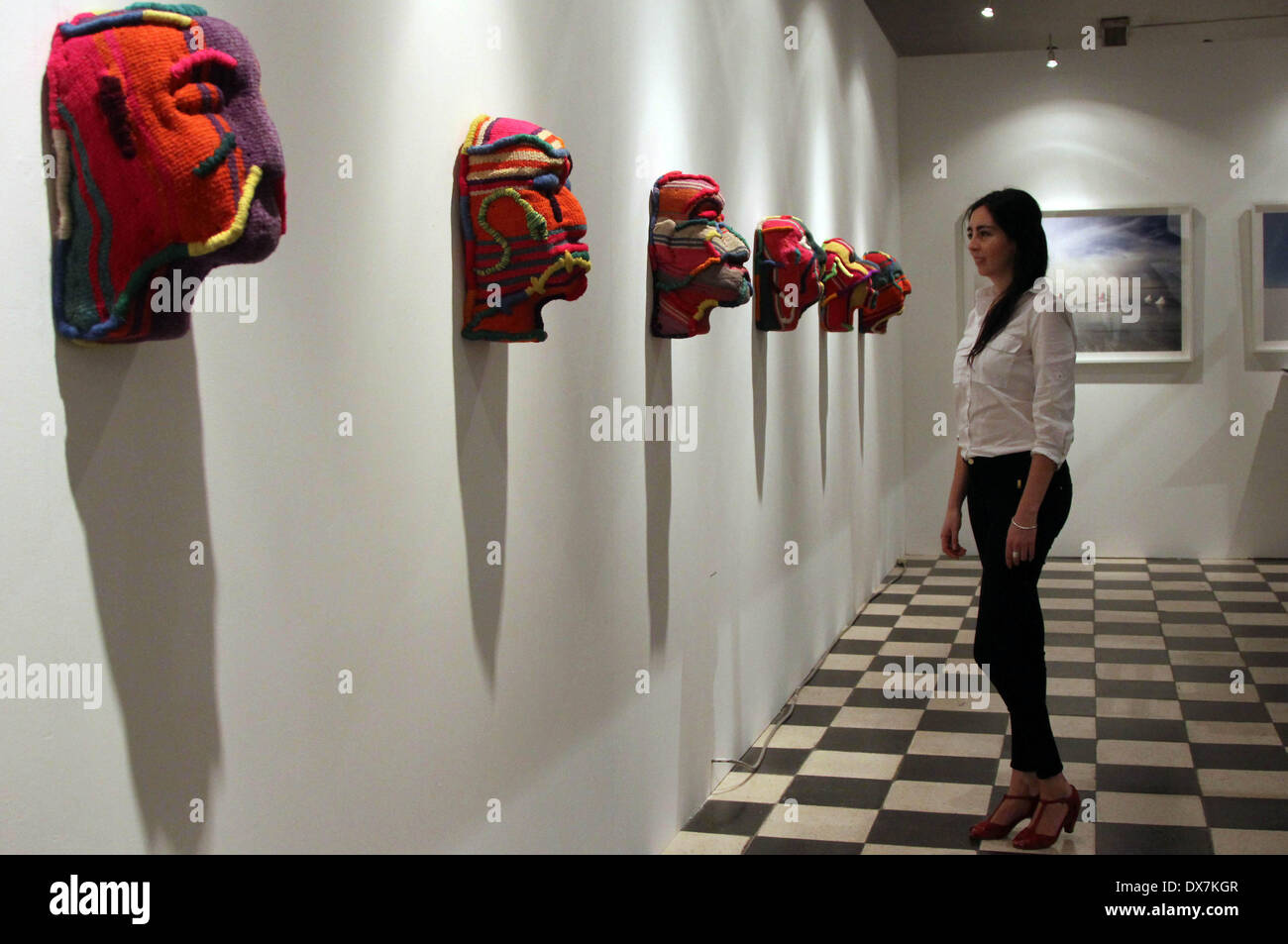 Lima, Peru. 19th Mar, 2014. A resident observes a work of the gallery ...