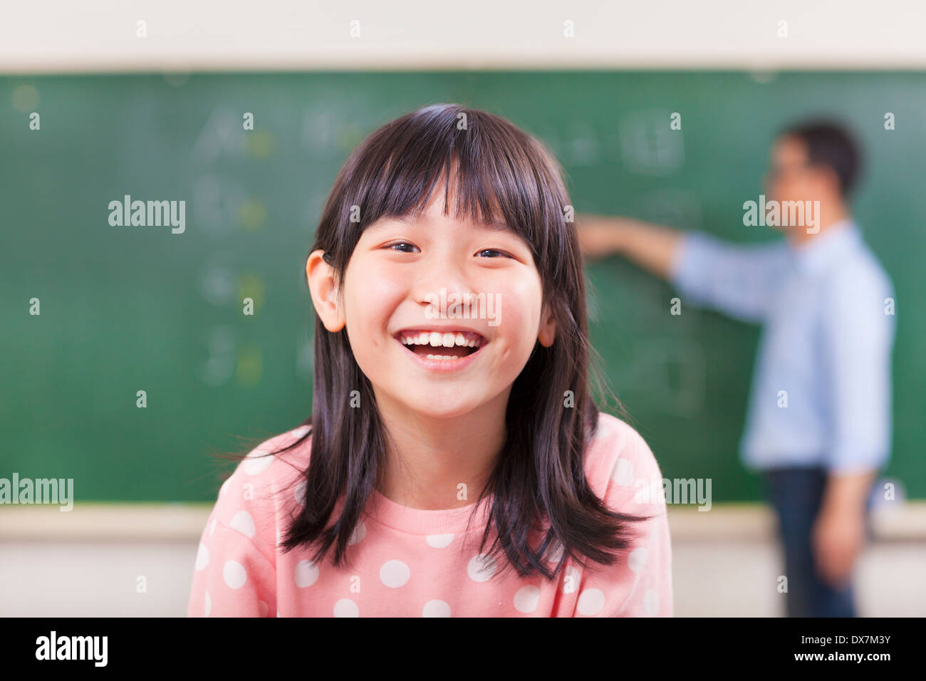 asian happy pupils smiling in class with teacher Stock Photo - Alamy