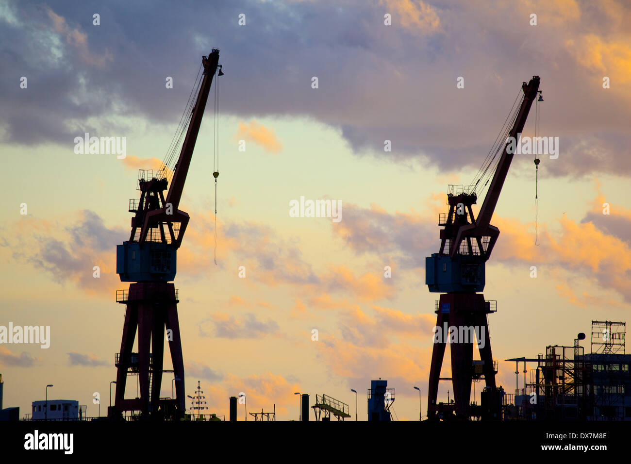 Europe, Scandinavia, Sweden, Gothenburg, Dockyard Cranes at Sunset ...