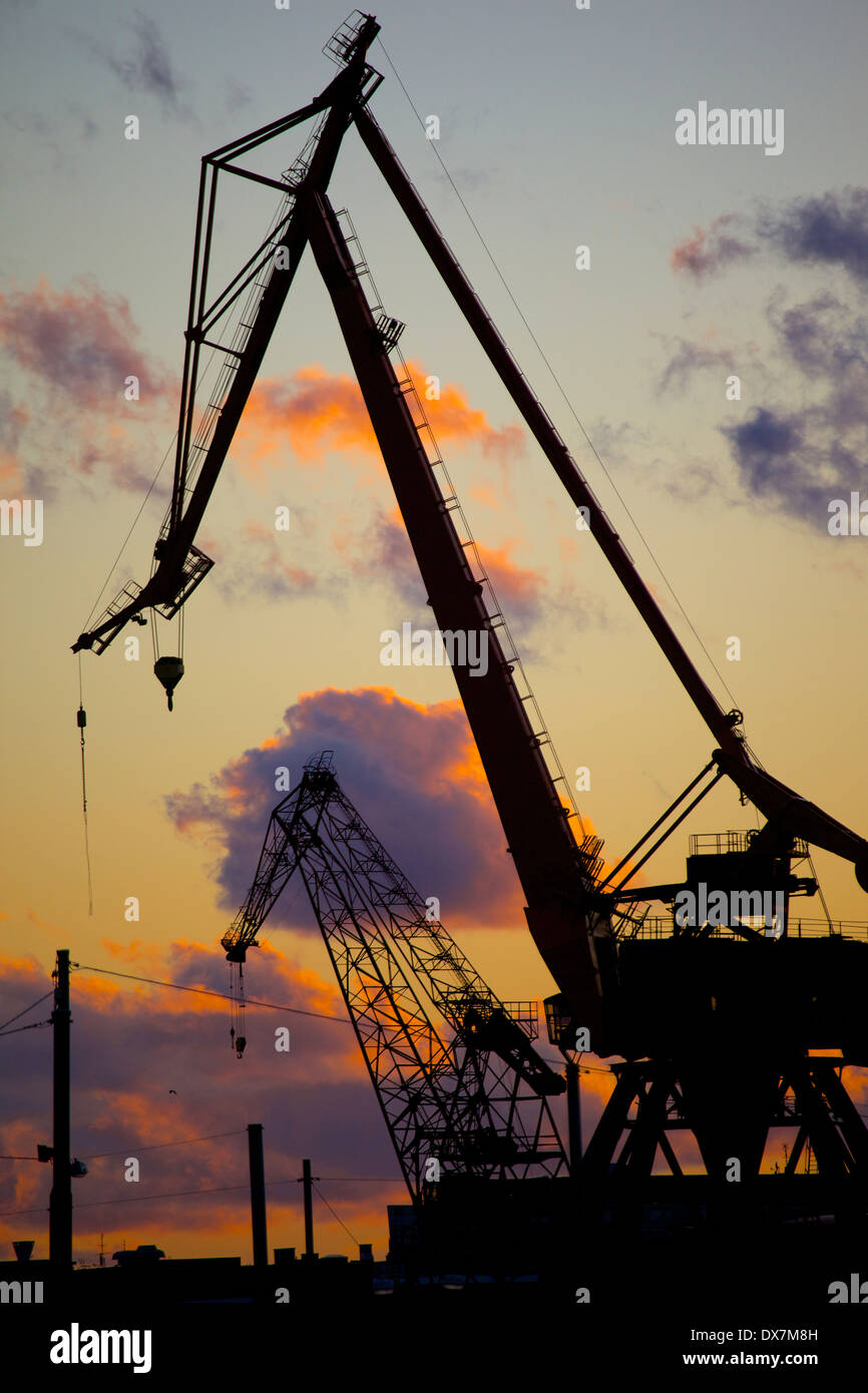 Europe, Scandinavia, Sweden, Gothenburg, Dockyard Cranes at Sunset ...