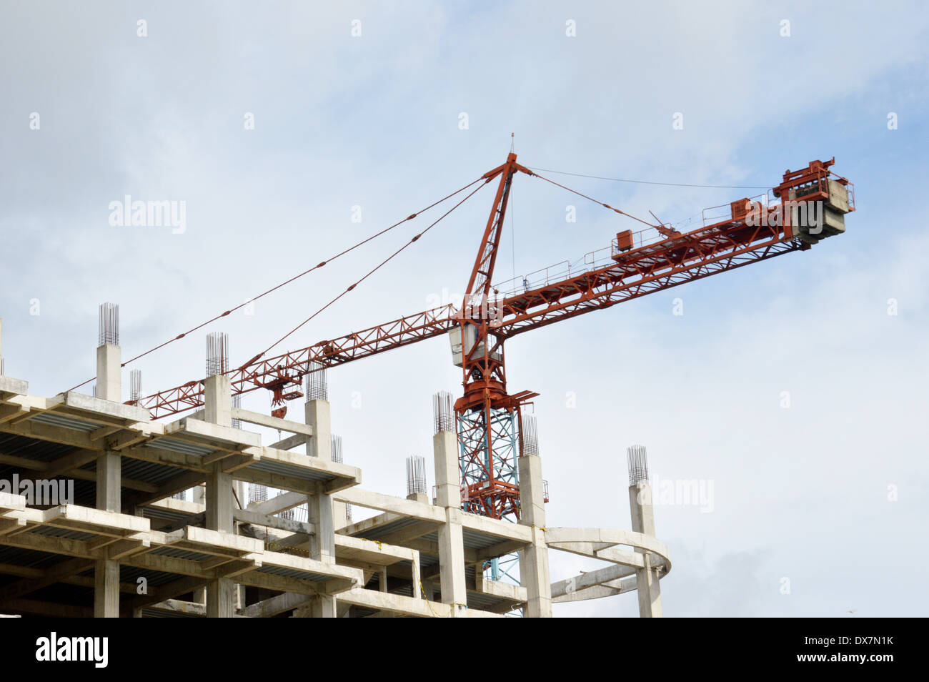 crane on a building in construction over blue sky Stock Photo - Alamy