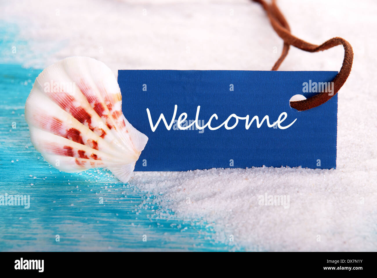 Welcome on a Label at the Beach with Shell Stock Photo - Alamy