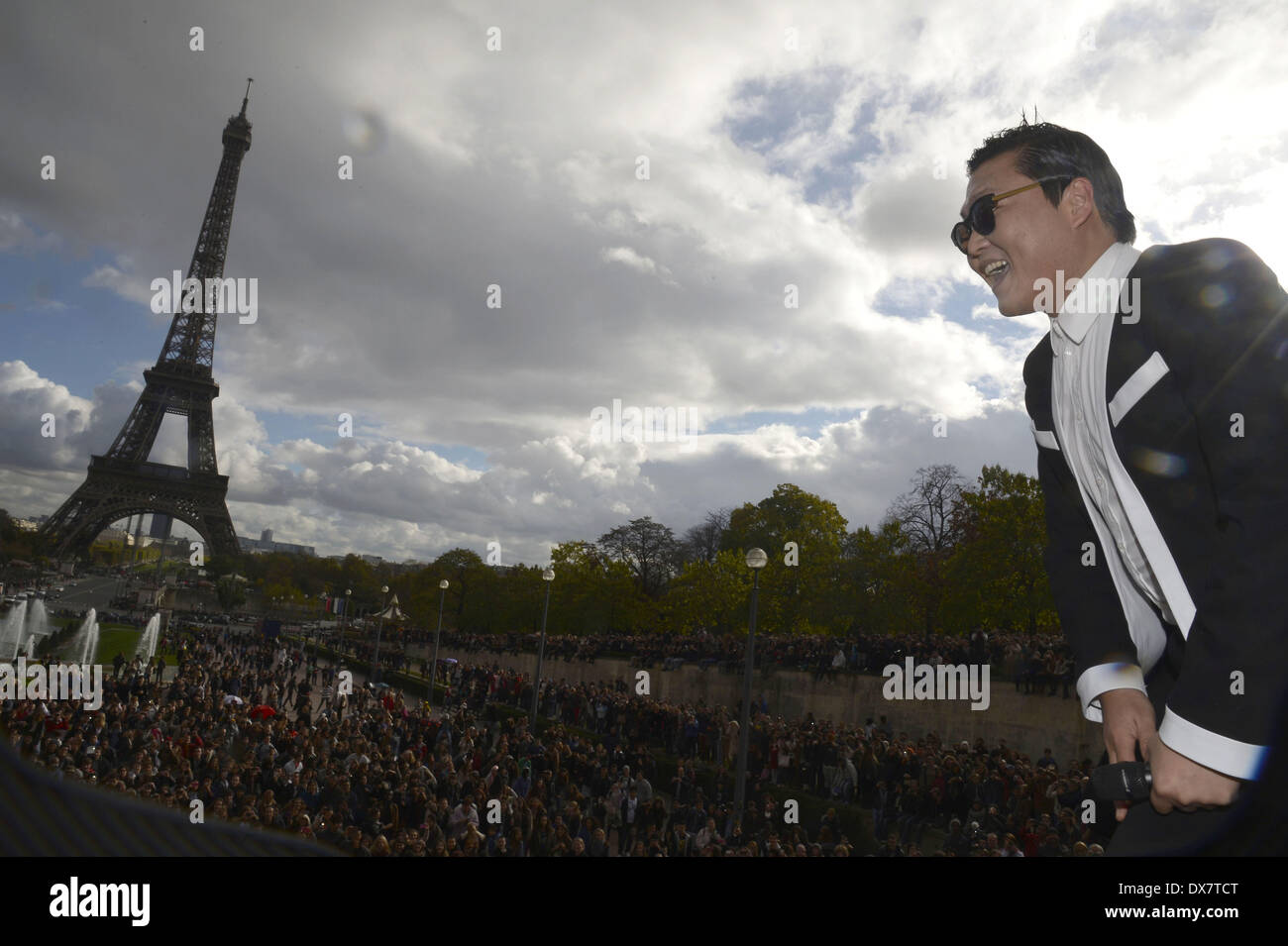 Psy performs his Gangnam Style dance for thousands of fans in front of the Eiffel tower ...