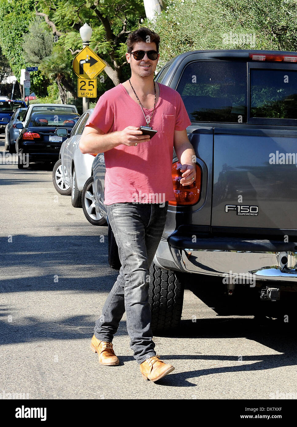 Robin Thicke and wife Paula Patton arriving at the voting polling ...