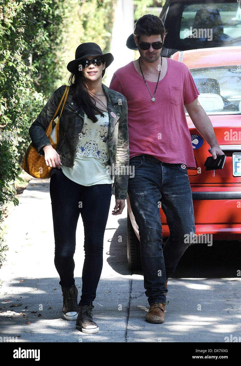 Robin Thicke and wife Paula Patton arriving at the voting polling ...