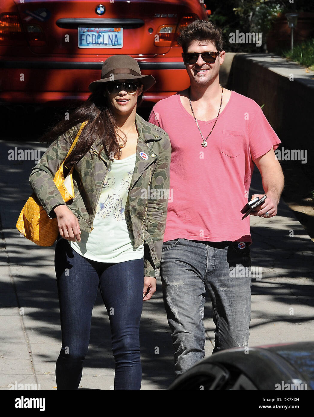 Robin Thicke and wife Paula Patton arriving at the voting polling ...