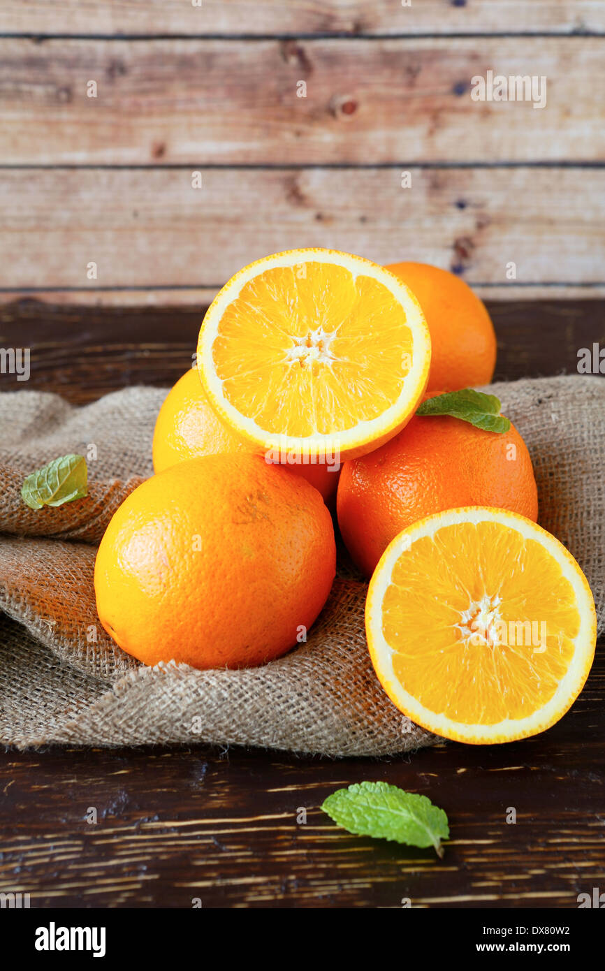 fresh oranges on sacking, food closeup Stock Photo - Alamy