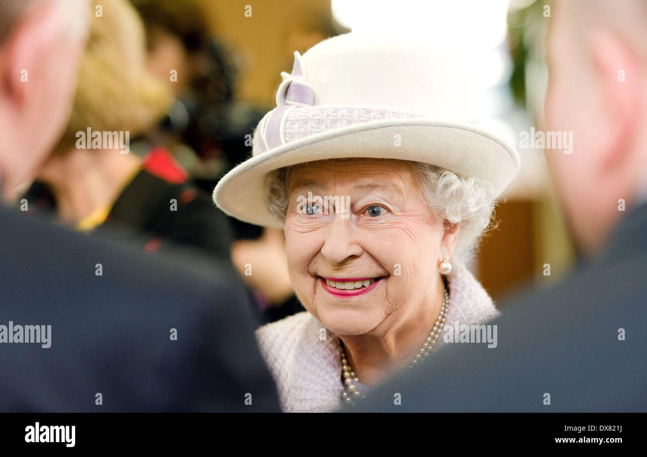 Britain's Queen Elizabeth II assembles her own poppy at The Poppy ...
