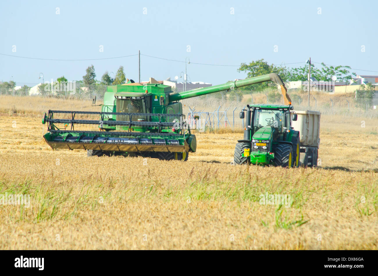 John Deere Combine harvester wheat Harvesting close up Stock Photo - Alamy