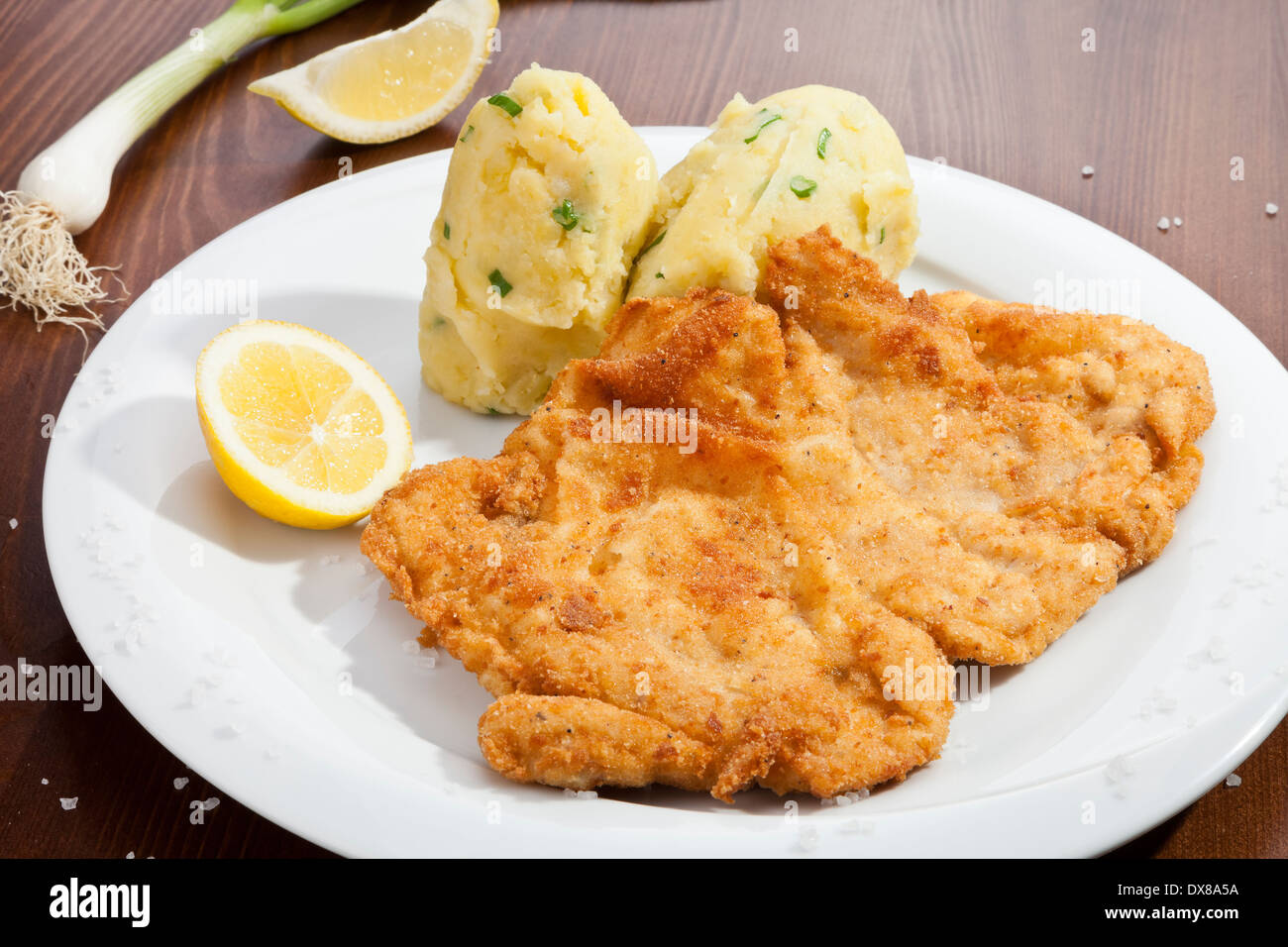 Vienna schnitzel with potato Vienna salad Stock Photo - Alamy