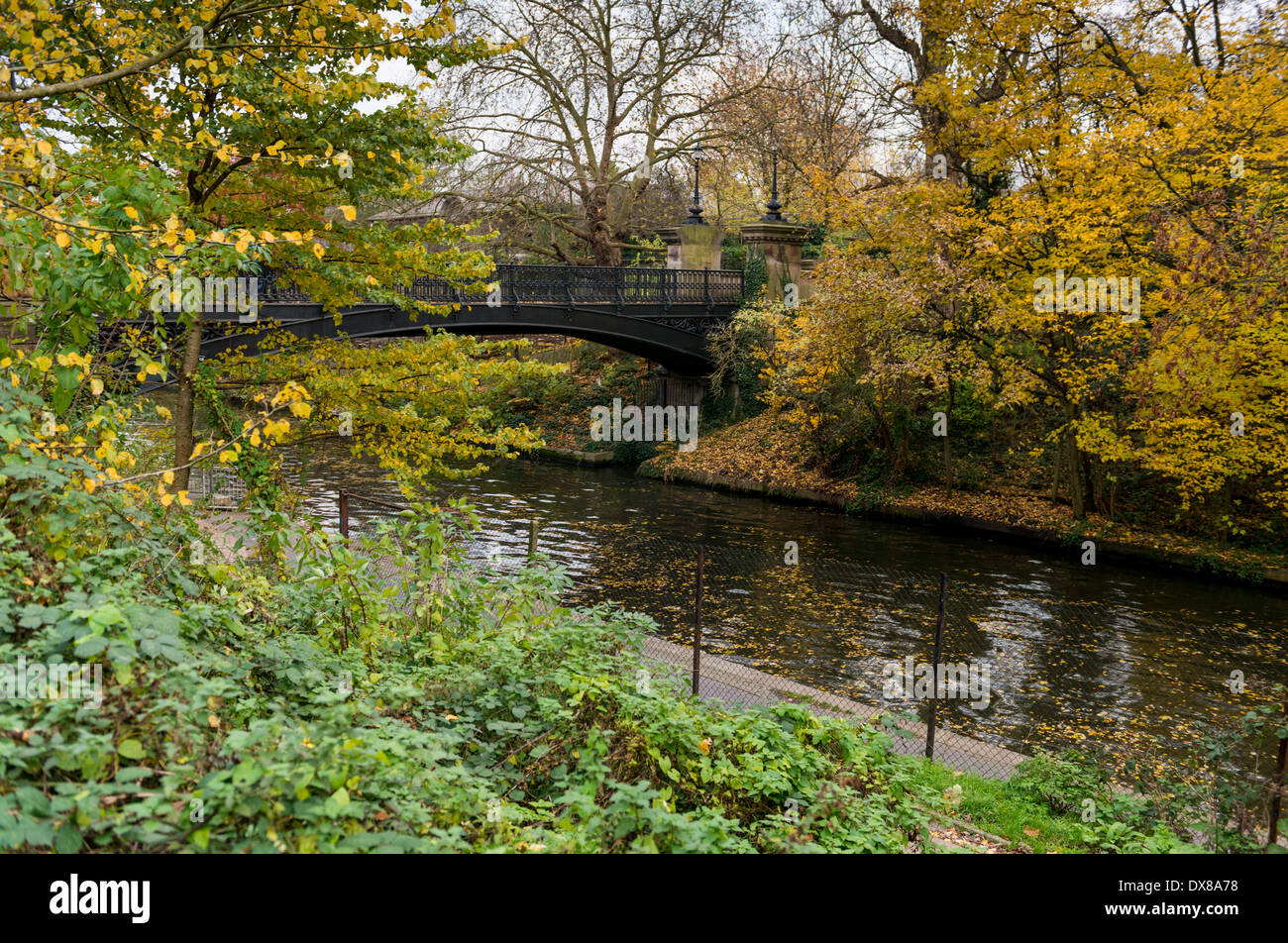 Primrose Hill Bridge, Regent's Park, London, shrouded in the golden ...