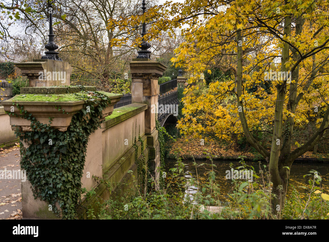 Primrose Hill Bridge, Regent's Park, London, shrouded in the golden ...