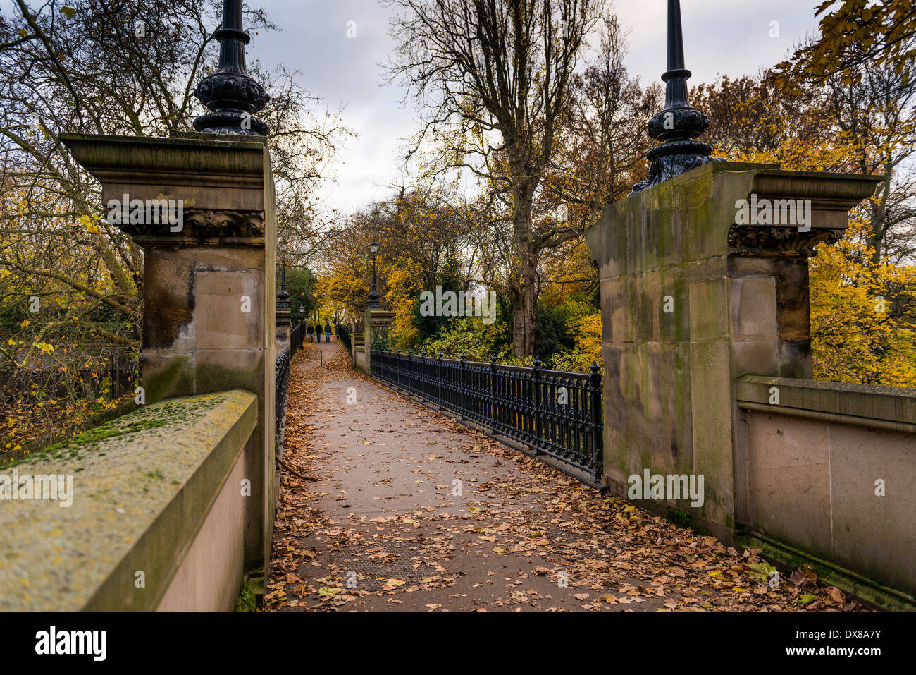 Primrose Hill Bridge, Regent's Park, London, shrouded in the golden ...