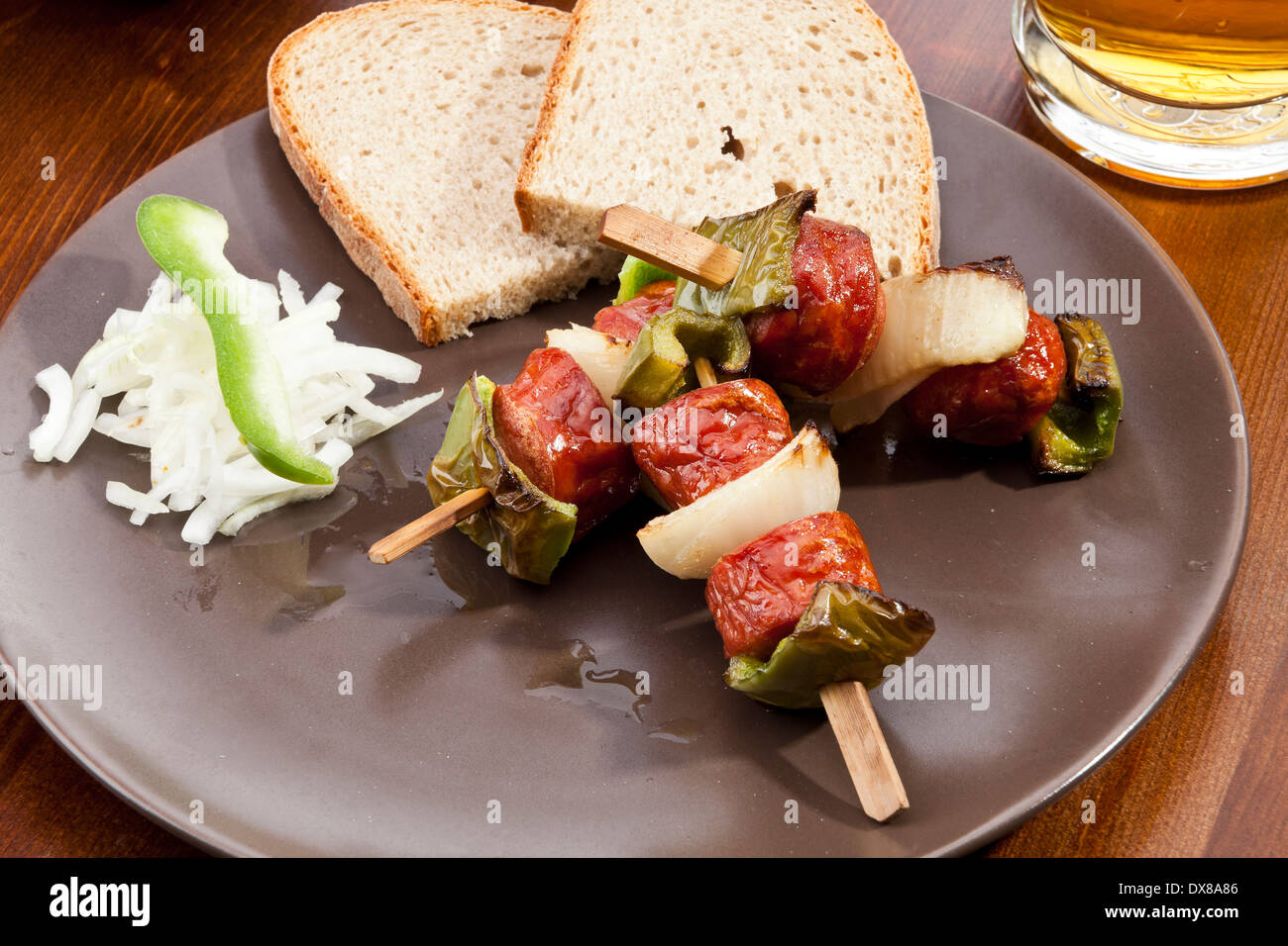 Grilled sausage on spit with the bread Stock Photo - Alamy