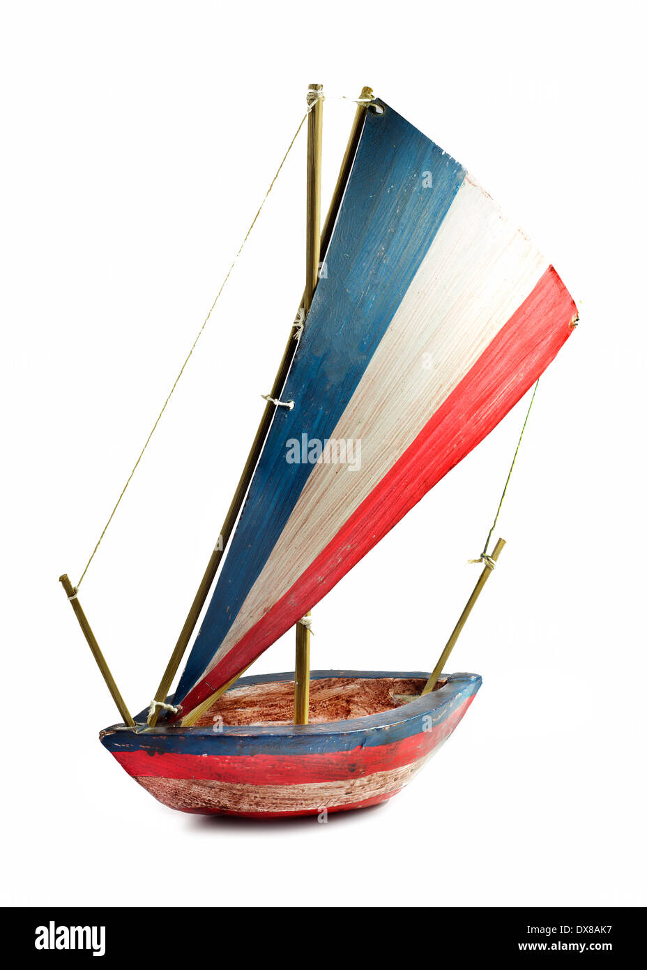 Blue sailboat sailing on Cut Out Stock Images & Pictures - Alamy