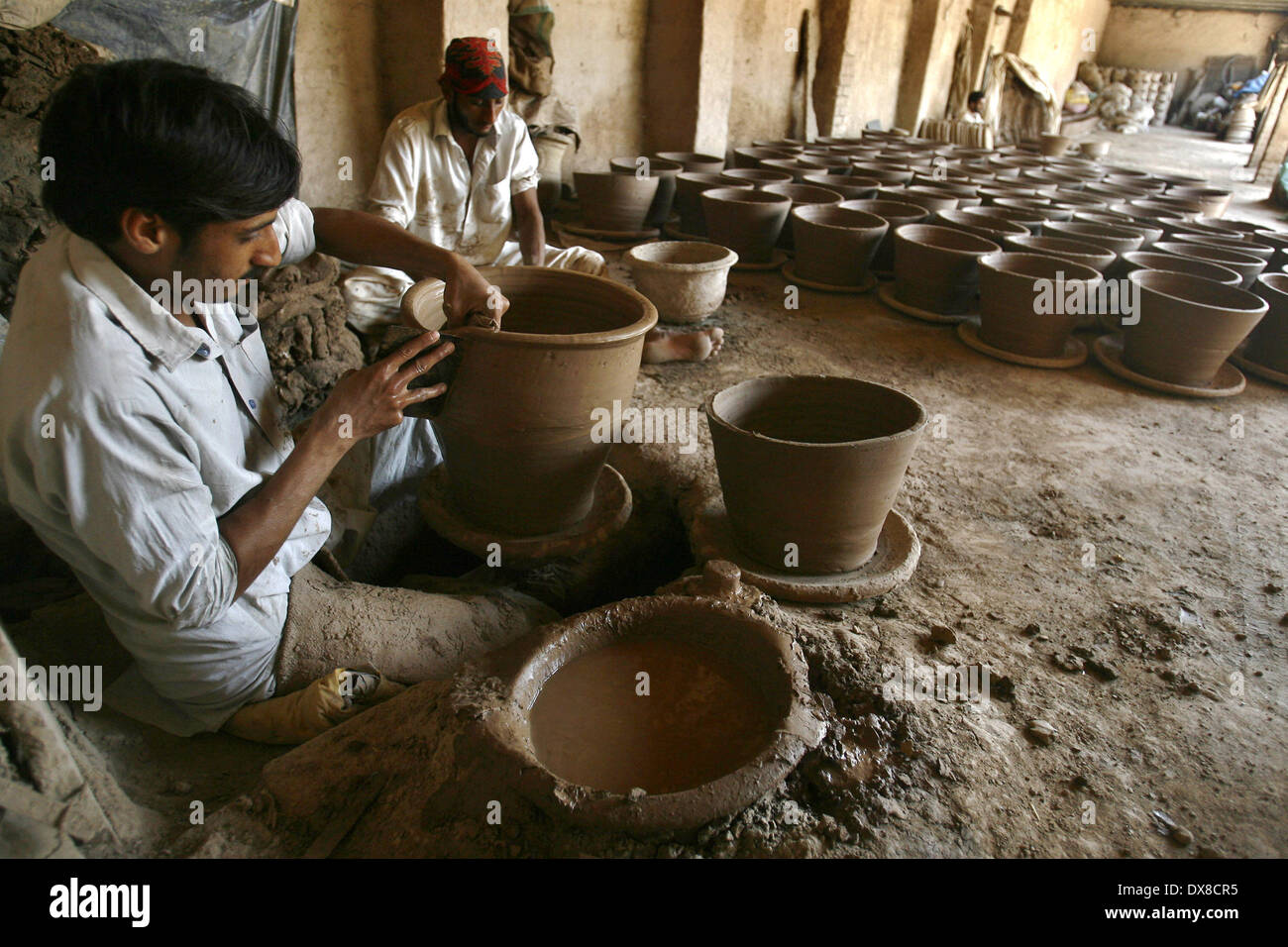 Peshawar, Pakistan. 20th Mar, 2014. Potters make traditional pottery ...