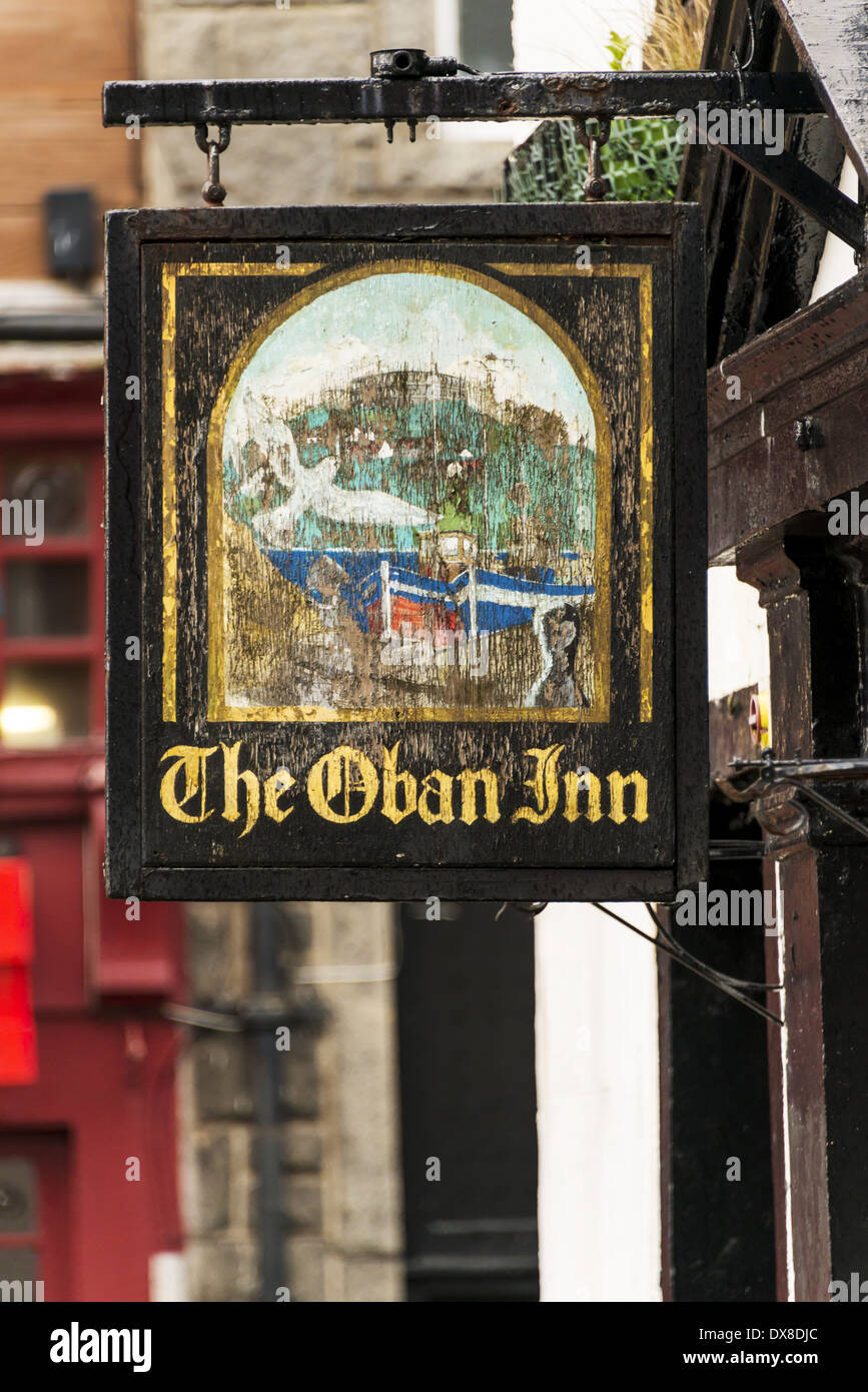 The sign of a now derelict pub, The Oban Inn, in Oban, a resort town ...