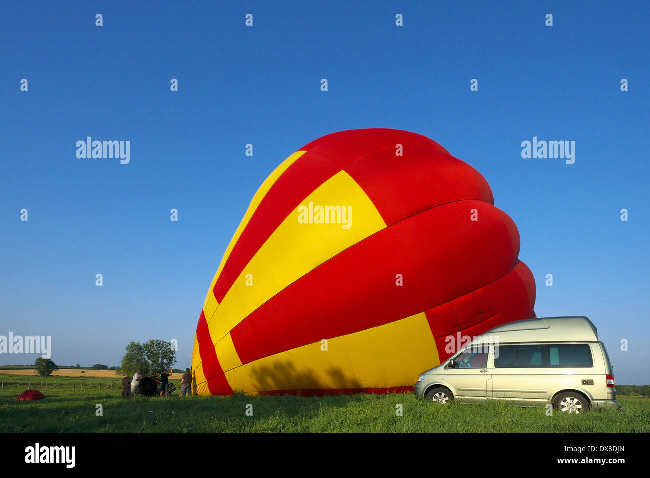 VW Volkswagen California camper next to colorful hot air balloon with ...