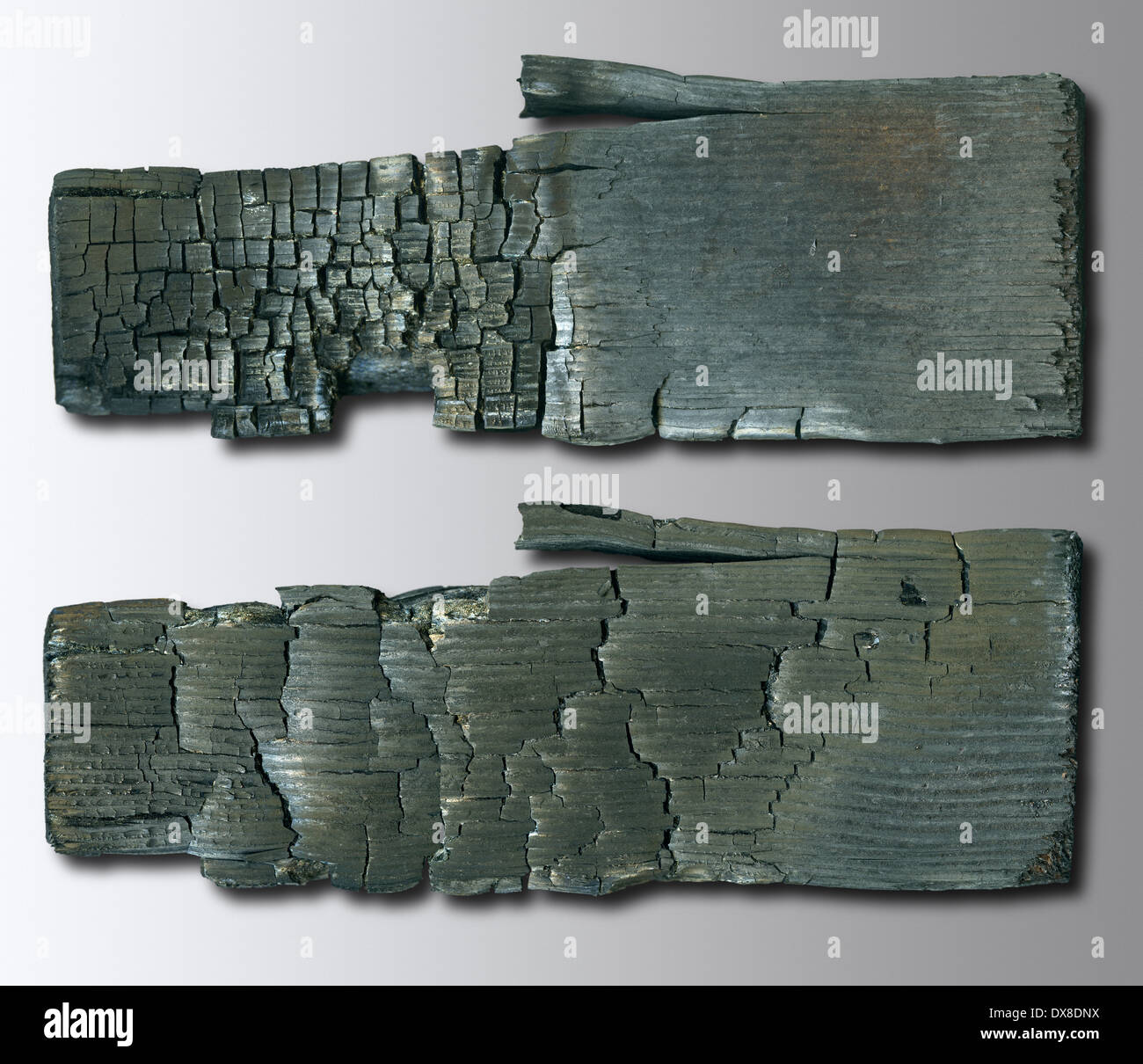 Two sections of charred black timber planking Stock Photo - Alamy