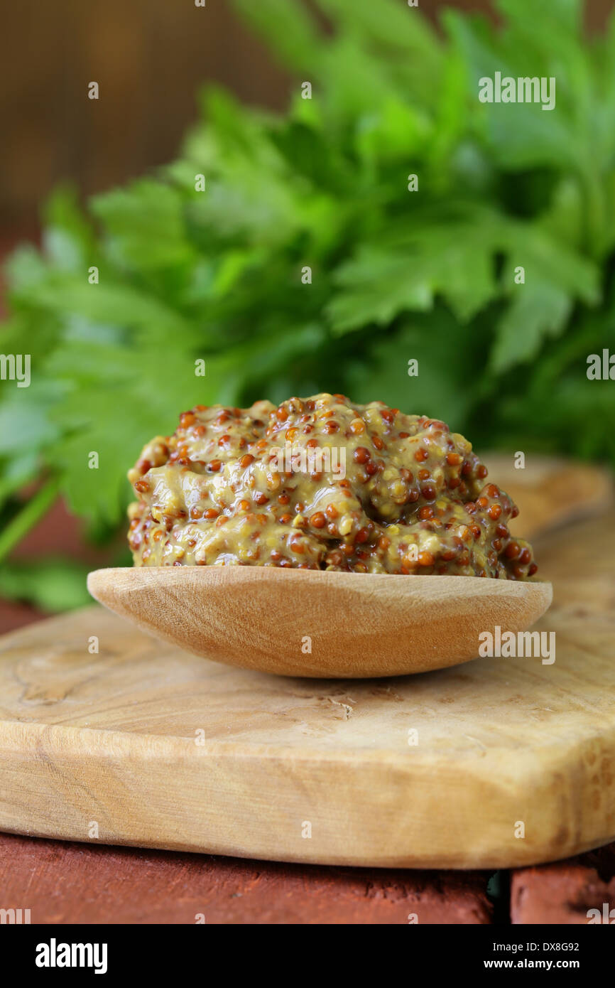 Traditional dijon mustard in a wooden spoon Stock Photo - Alamy
