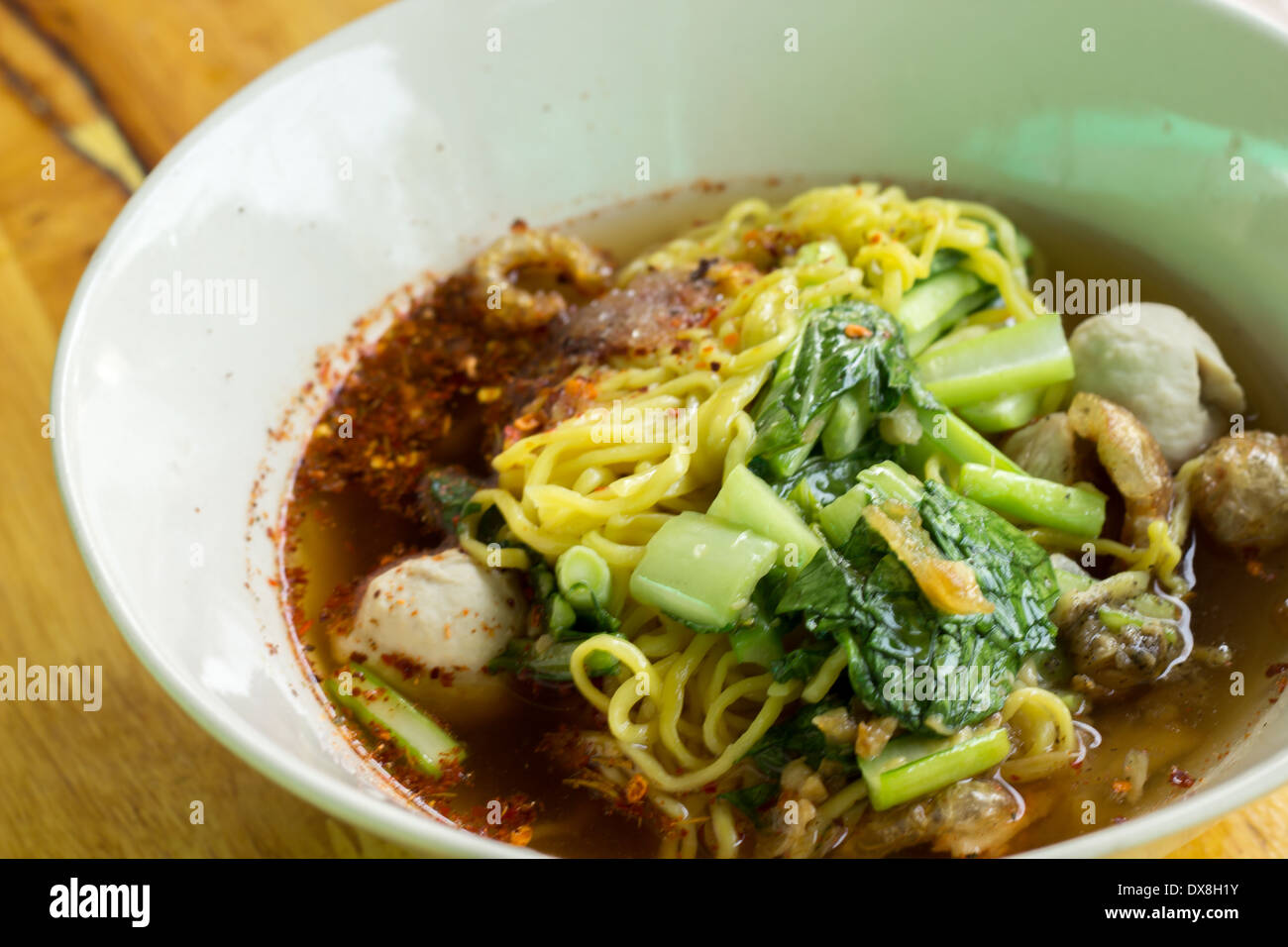 The Noodles on a wood table ready to eat Stock Photo - Alamy