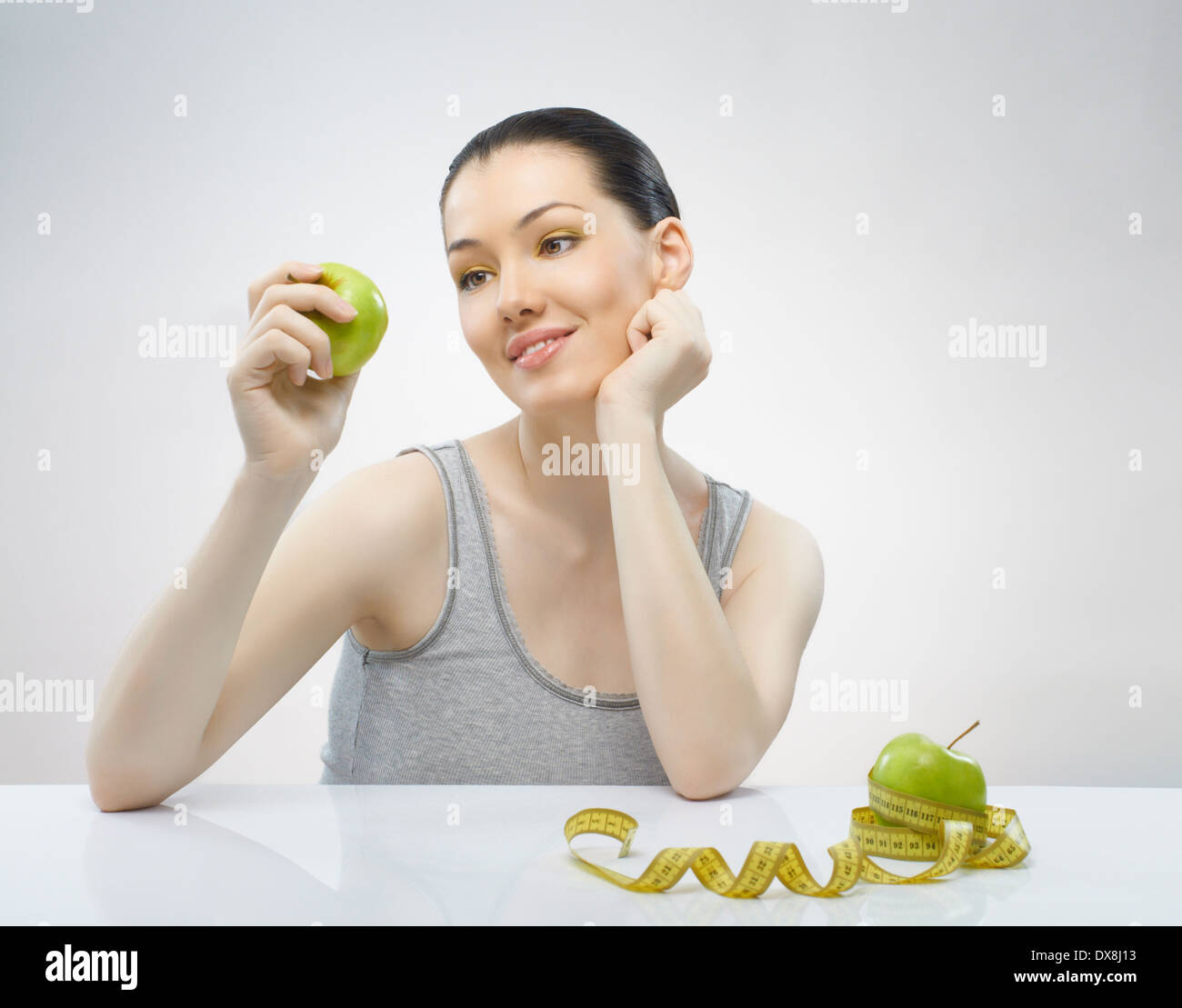 A beautiful slender girl eating healthy food Stock Photo - Alamy