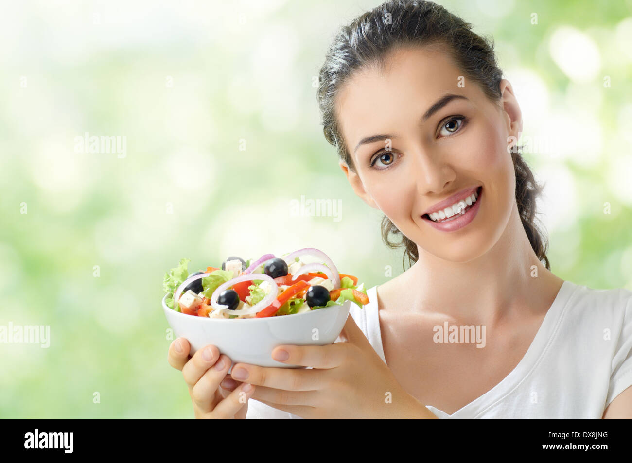 A beautiful girl eating healthy food Stock Photo - Alamy
