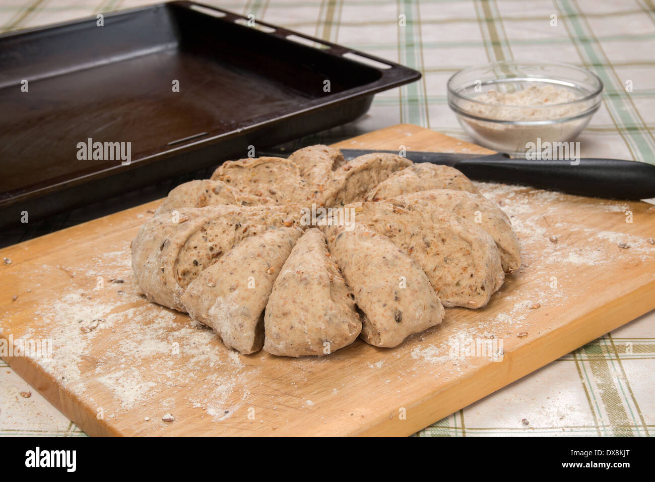 Making brown Granary bread buns dividing dough (2 0f 15 Stock Photo - Alamy