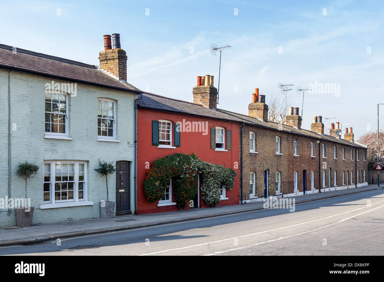 Row of Typical traditional English terraced cottages with shutters and ...