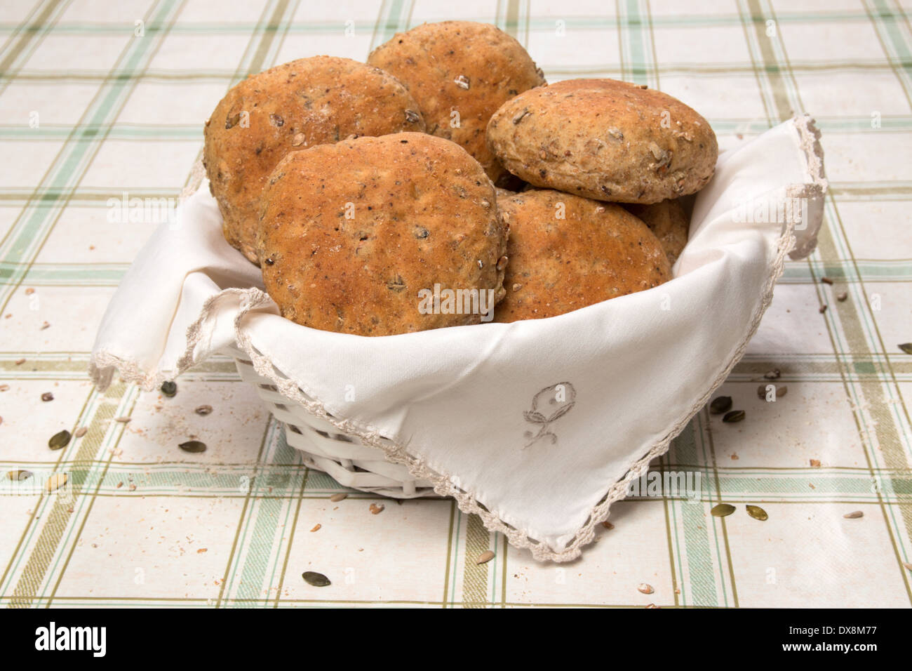 brown Granary bread bun/baps/cakes in a white bread basket (7 of 15 ...