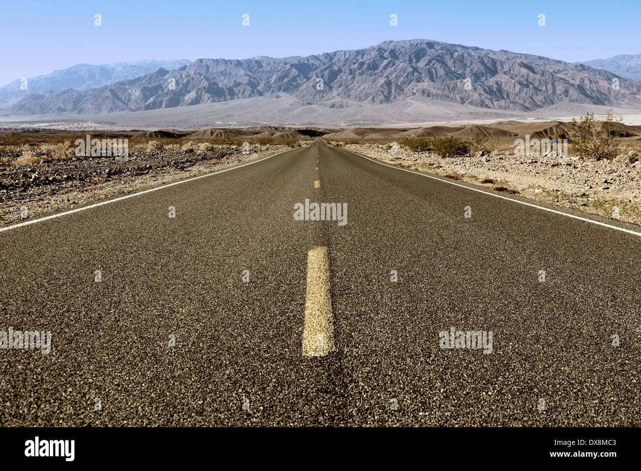 desolate road within death valley California Stock Photo - Alamy