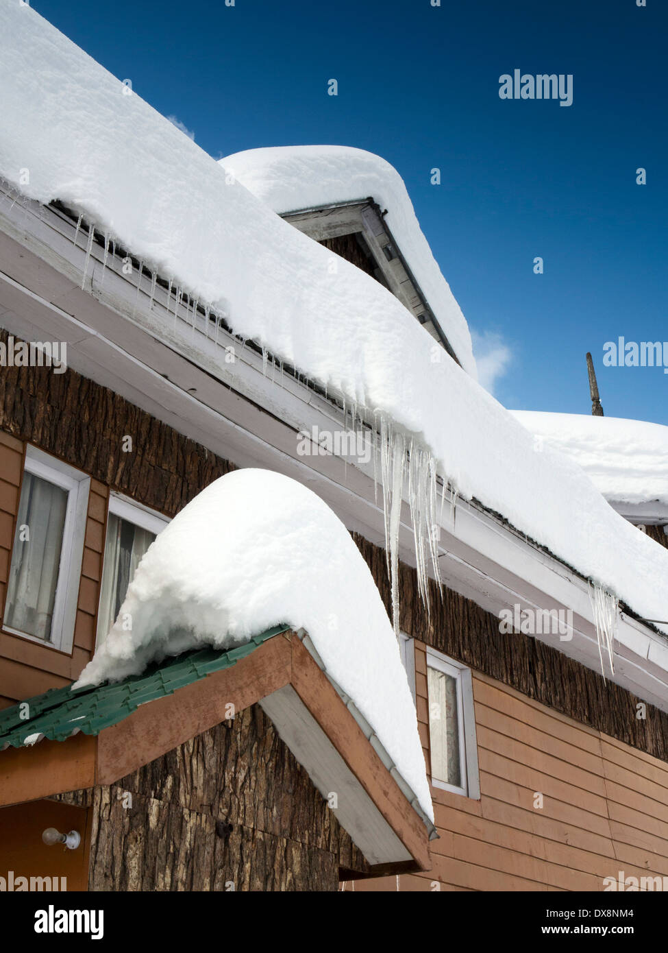India, Kashmir, Gulmarg, Himalayan Ski Resort, snow laden roof, and ...