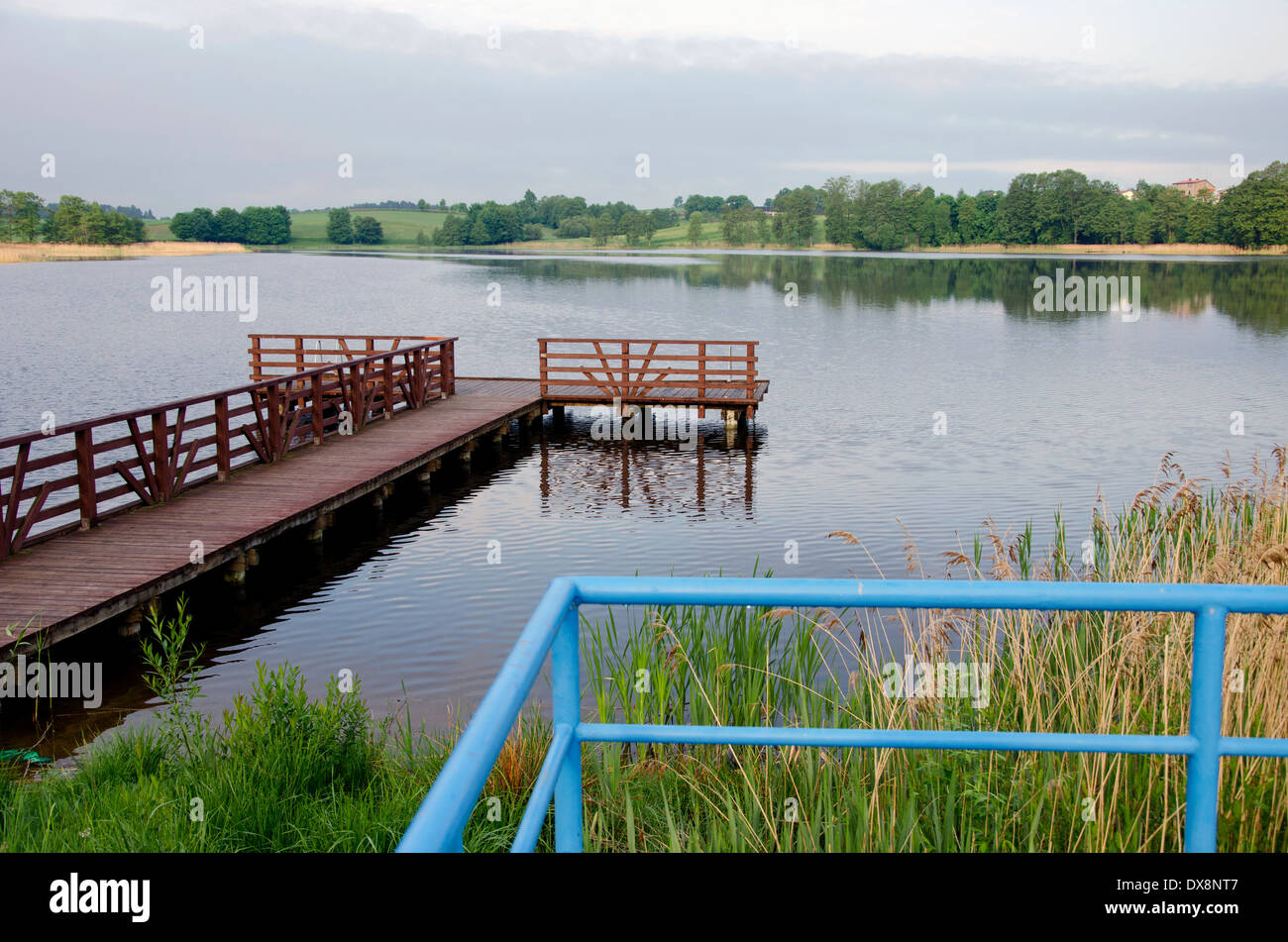 wooden bridge pier on beautiful resort lake Stock Photo - Alamy