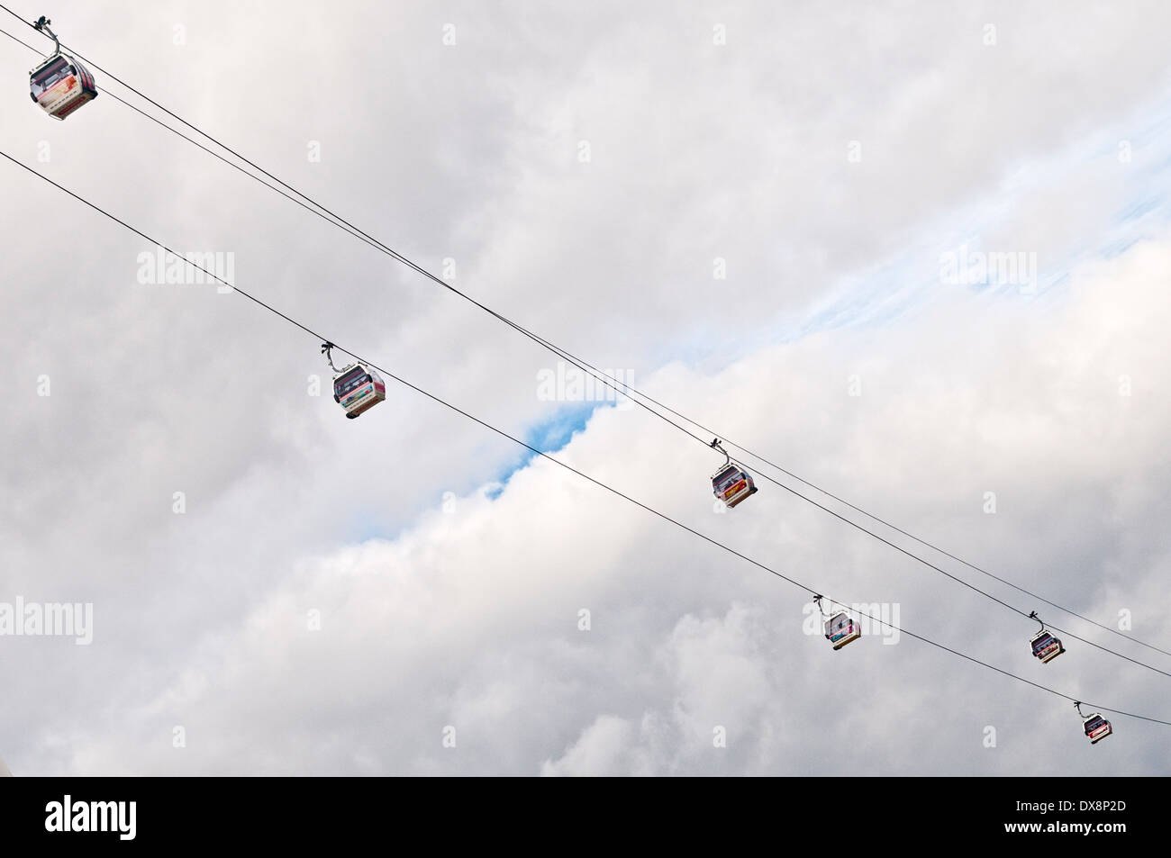 Upward View of Thames Cable Car System traveling over the river Thames ...