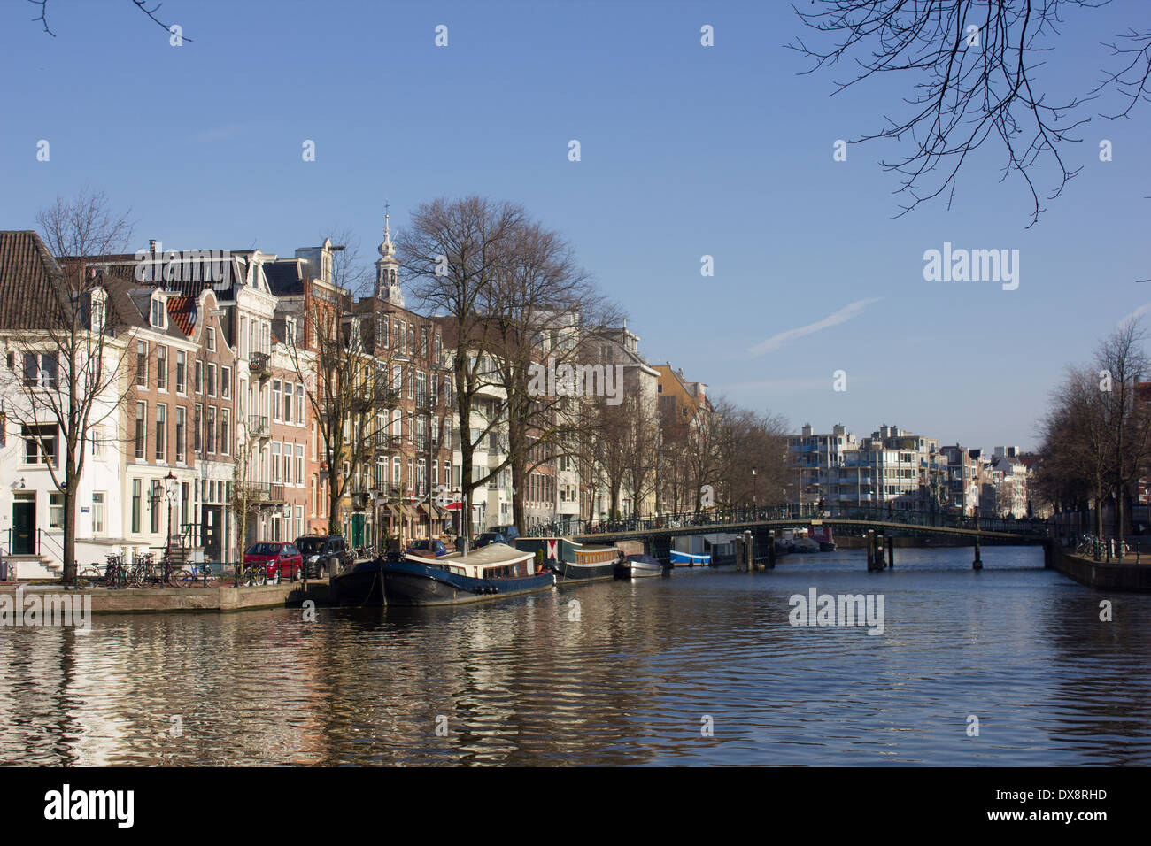 traditional dutch houses with iron bridge over canal and canal boats ...