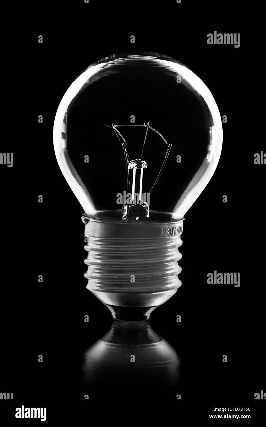 Light bulb isolated black background hi-res stock photography and ...