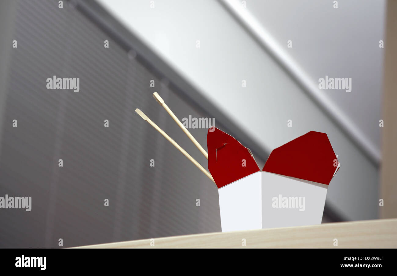 Chinese food box on office desk Stock Photo - Alamy
